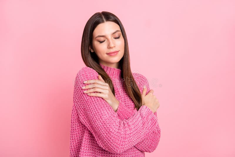 Portrait Of Brunette Optimistic Girl Hug Herself Wear Pink Sweater