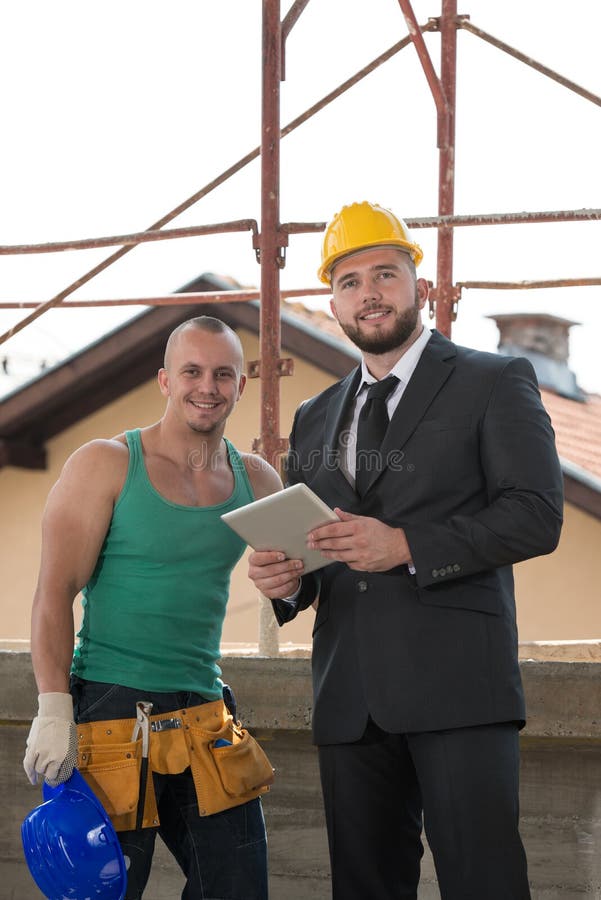 Portrait of Builder and Businessman Working at Construction Stock Photo ...