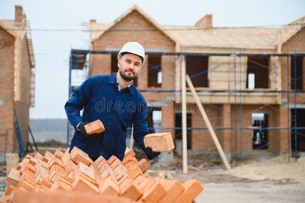 Portrait of a Builder on a Construction Site. Construction of Brick ...