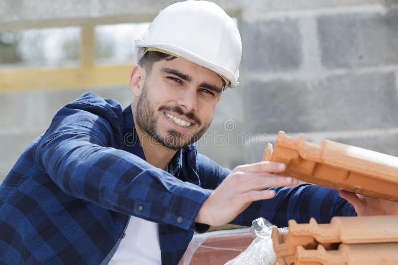 Portrait Builder Lifting Roof Tiles Stock Image - Image of labor ...