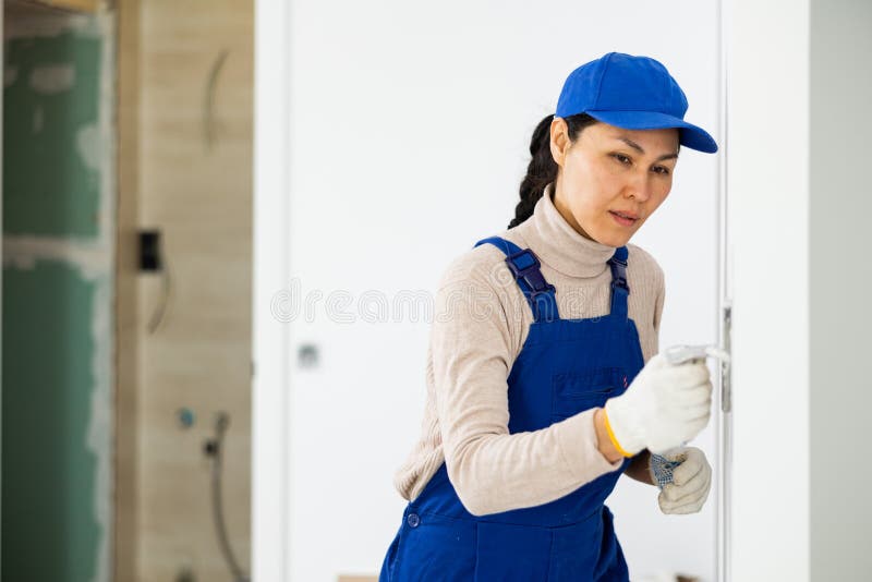 Portrait of Female Builder in Process of Finishing Work in Cottage ...