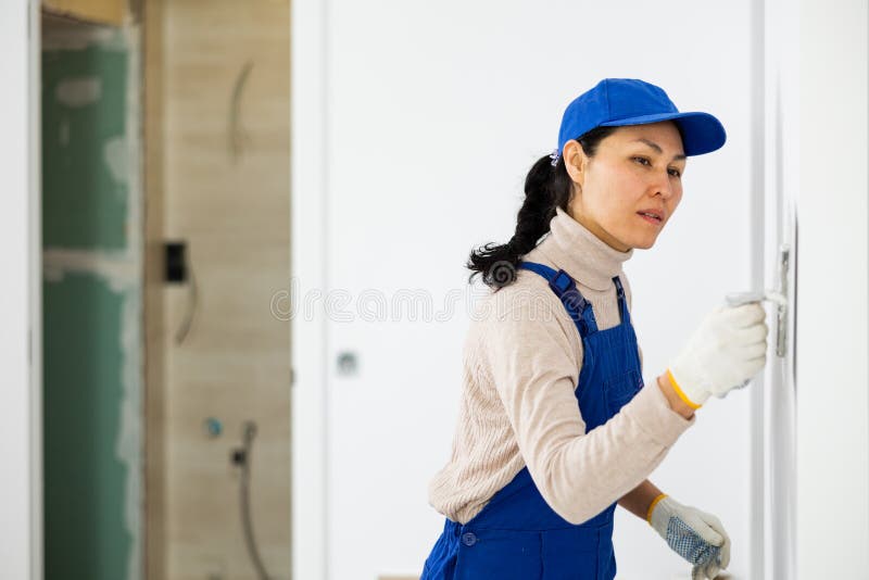 Portrait of Female Builder in Process of Finishing Work in Cottage ...