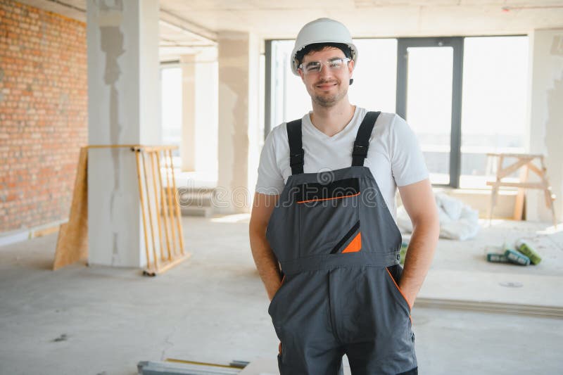 Portrait of a Builder in the Process of Working on a Construction Site ...