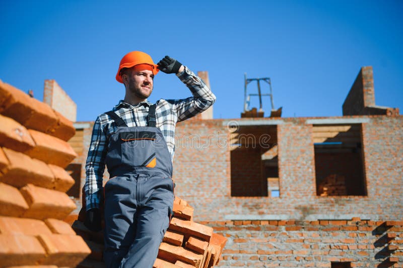 Portrait of a Builder in the Process of Working on a Construction Site ...