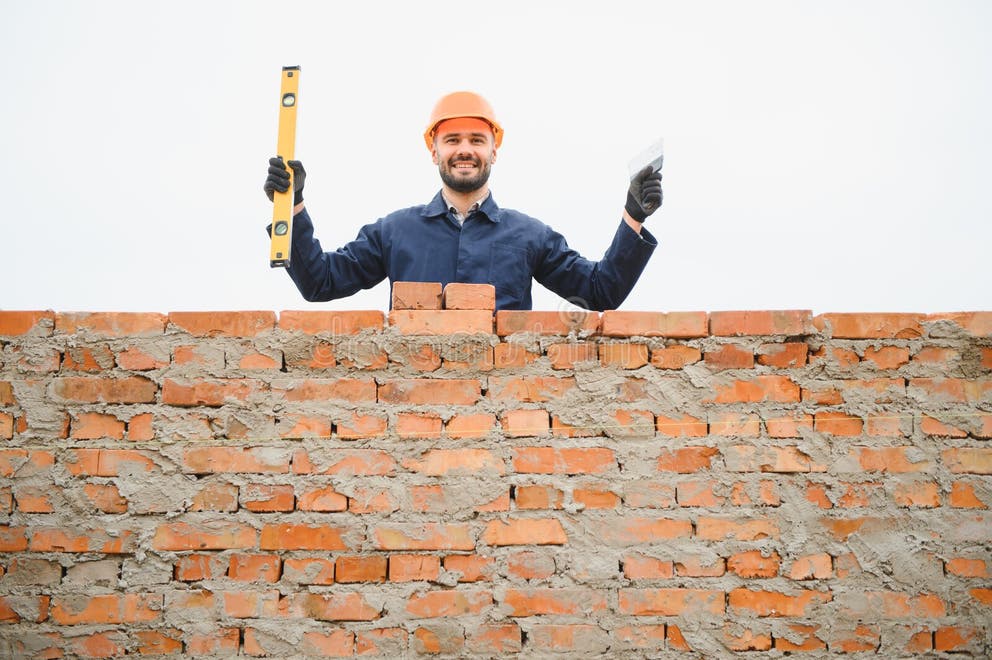 Portrait of a Builder in the Process of Working on a Construction Site ...