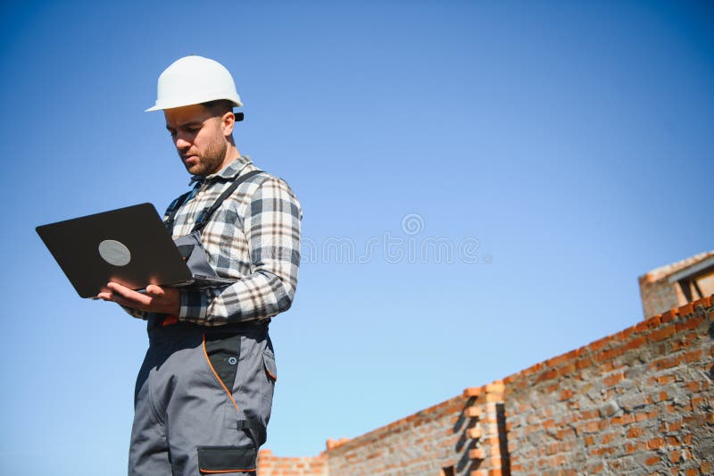 Portrait of a Builder in the Process of Working on a Construction Site ...