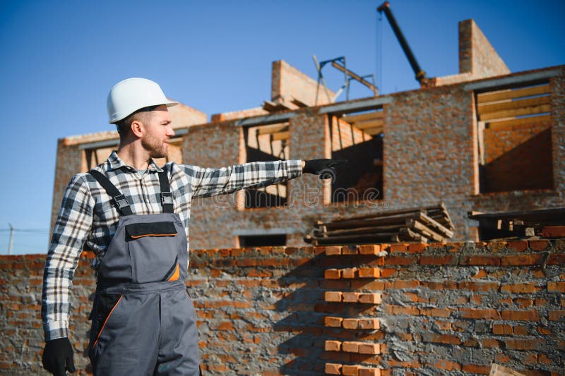 Portrait of a Builder in the Process of Working on a Construction Site ...