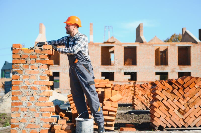 Portrait of a Builder in the Process of Working on a Construction Site ...
