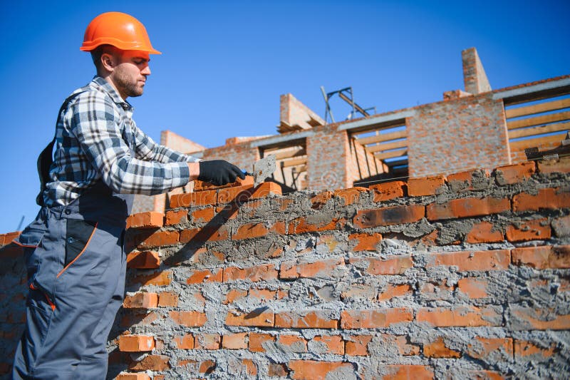 Portrait of a Builder in the Process of Working on a Construction Site ...