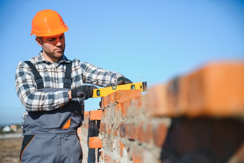 Portrait of a Builder in the Process of Working on a Construction Site ...