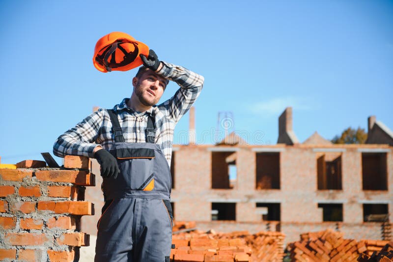 Portrait of a Builder in the Process of Working on a Construction Site ...
