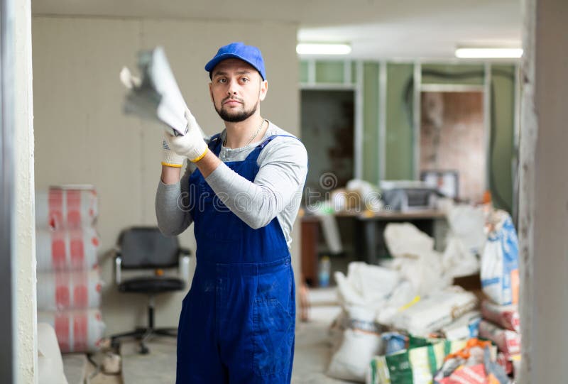Portrait of a Builder in the Process of Working on a Construction Site ...