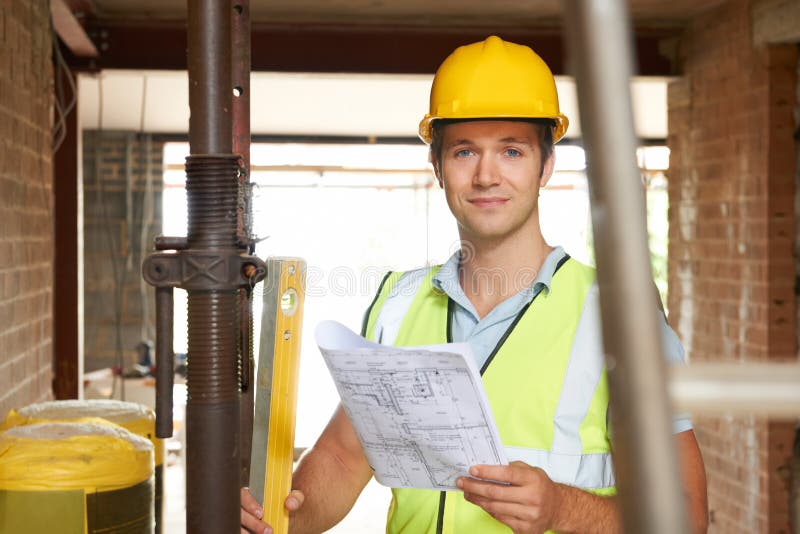 Portrait of Builder on Site with Plans Stock Image - Image of accuracy ...