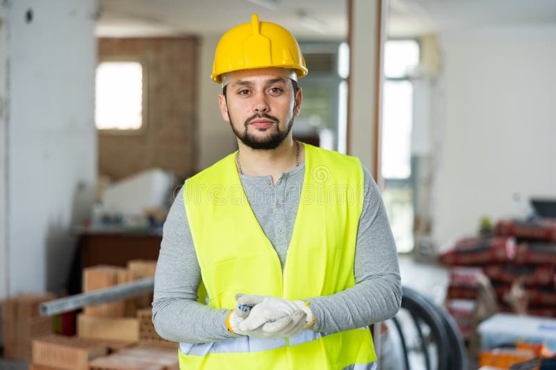 Portrait of a Builder Standing on a Construction Site Indoors Stock ...