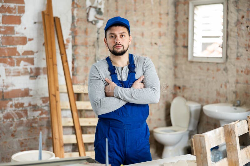 Portrait of a Builder Standing on a Construction Site Indoors Stock ...