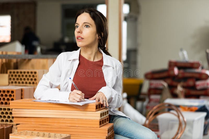 Portrait of an Builder Woman Who Checks Completed Work on Stock Image ...