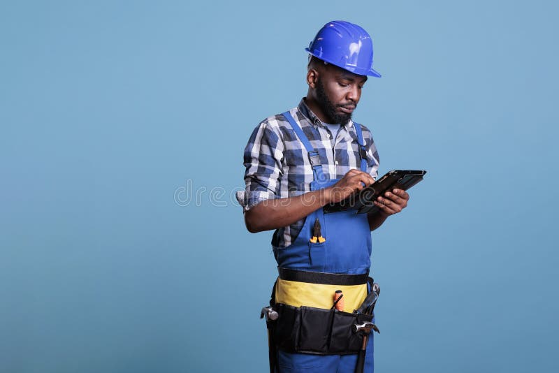 Builder Shopping Online for Materials with Digital Tablet Stock Photo ...