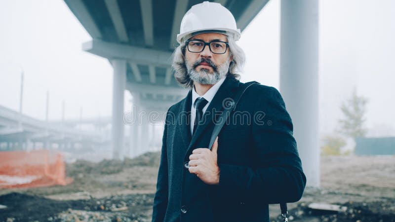 Portrait of Building Project Supervisor Standing in Construction Site ...