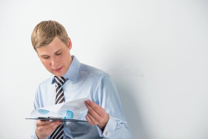 Portrait of a Business Man Reading Documents Stock Image - Image of ...
