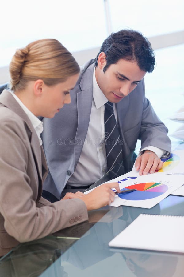 Portrait of Business People Studying Statistics Stock Image - Image of ...