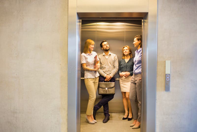 Business People Waiting for Elevator Stock Photo - Image of gesturing ...