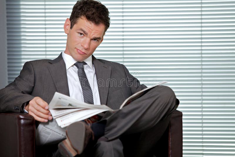 Portrait of Businessman Holding Newspaper in Office Stock Photo - Image ...