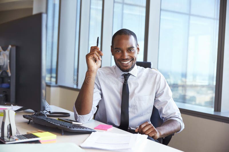 Portrait of Businessman at Office Desk Using Computer Stock Image ...