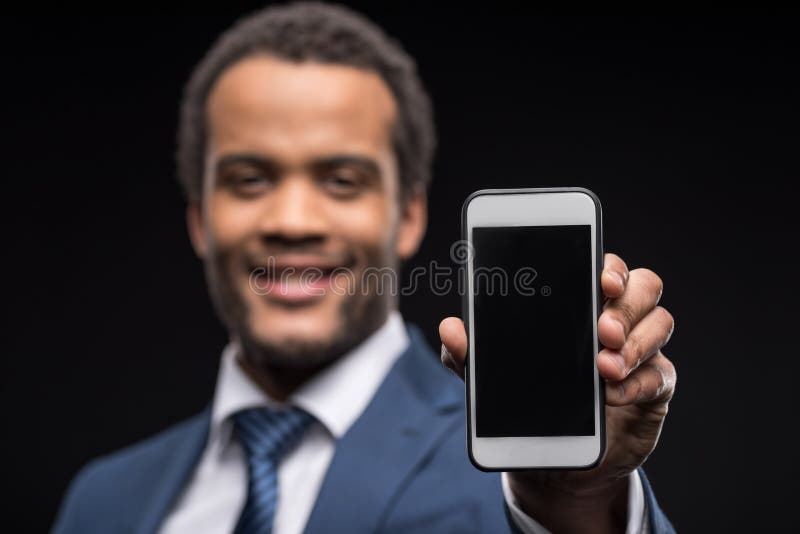 Portrait of Businessman Presenting Smartphone with Black Screen Stock ...