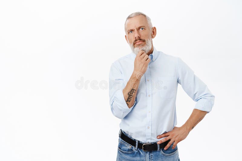 Portrait of Businessman Thinking, Touching Beard and Looking Skeptical ...