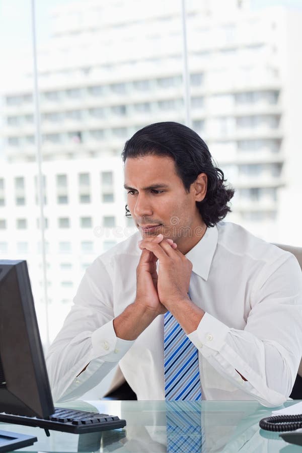 Portrait of a Businessman Thinking while Using a Computer Stock Image ...