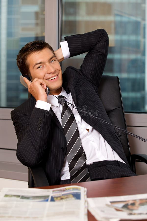 Portrait of Businessman Using Telephone in Office, Smiling Stock Image ...