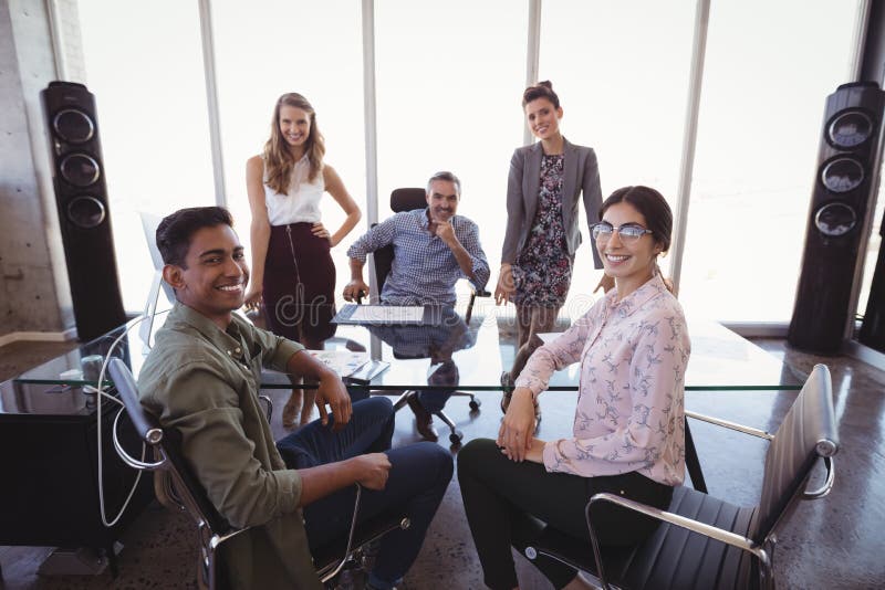 Portrait of Businessman with Young Creative Team Stock Image - Image of ...
