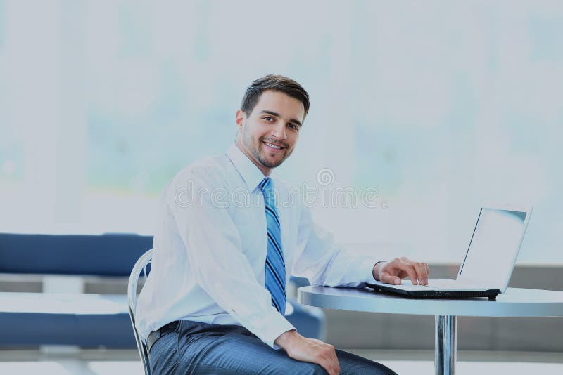 Portrait of Busy Manager Typing on the Laptop in the Office. Stock ...