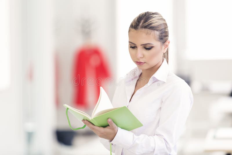 Portrait of Busy Secretary Looking at Camera Stock Photo - Image of ...