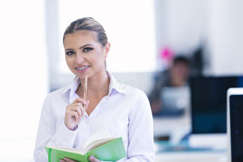 Portrait of Busy Secretary Looking at Camera Stock Photo - Image of ...