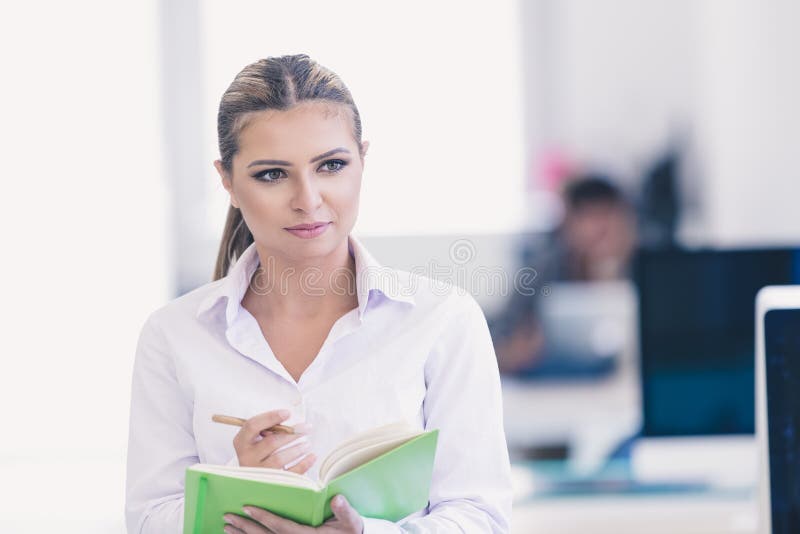 Portrait of Busy Secretary Looking at Camera Stock Photo - Image of ...