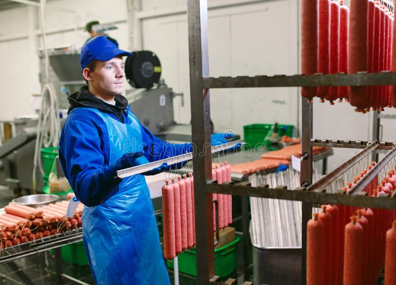 Portrait of Butchers Processing Sausages at a Meat Factory Stock Photo ...