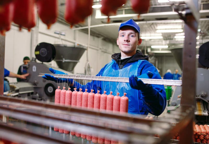 Portrait of Butchers Processing Sausages at Meat Factory. Stock Photo ...