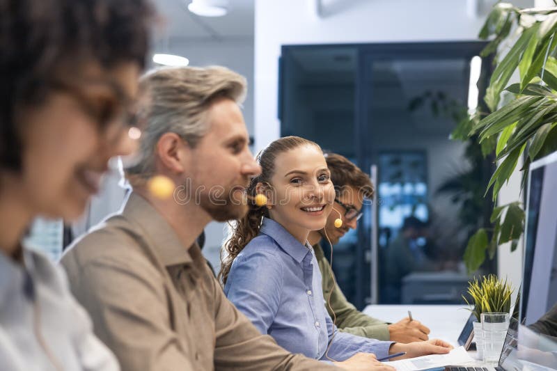 Portrait of Call Center Worker Accompanied by Her Team. Smiling ...