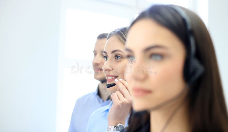 Portrait of Call Center Worker Accompanied by Her Team. Smiling ...