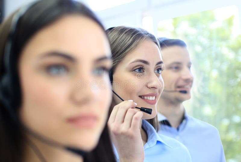 Portrait of Call Center Worker Accompanied by Her Team. Smiling ...