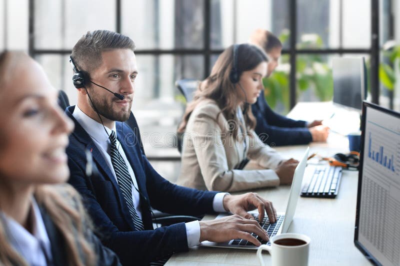 Portrait of Call Center Worker Accompanied by Her Team. Smiling ...