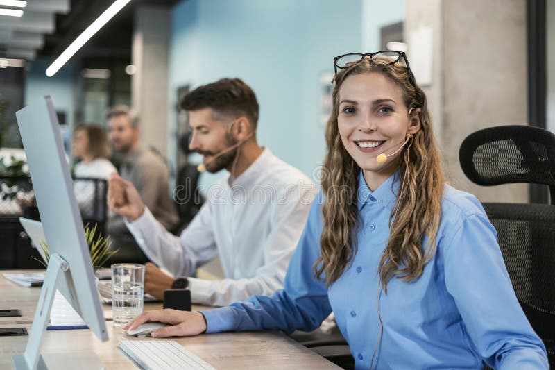 Portrait of Call Center Worker Accompanied by Her Team. Smiling ...