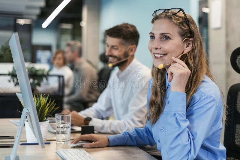 Portrait of Call Center Worker Accompanied by Her Team. Smiling ...