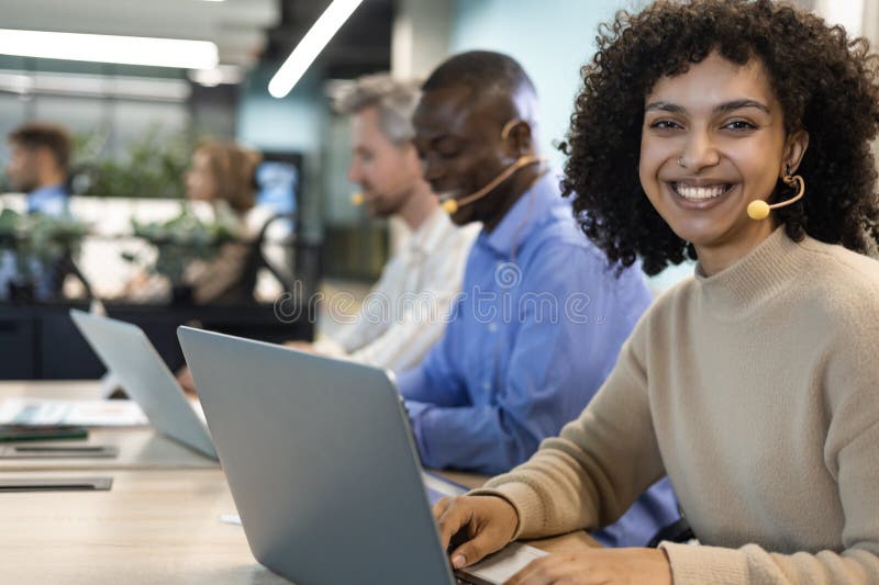 Portrait of Call Center Worker Accompanied by Her Team. Smiling ...