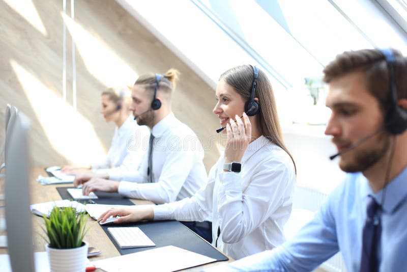 Portrait of Call Center Worker Accompanied by His Team. Smiling ...