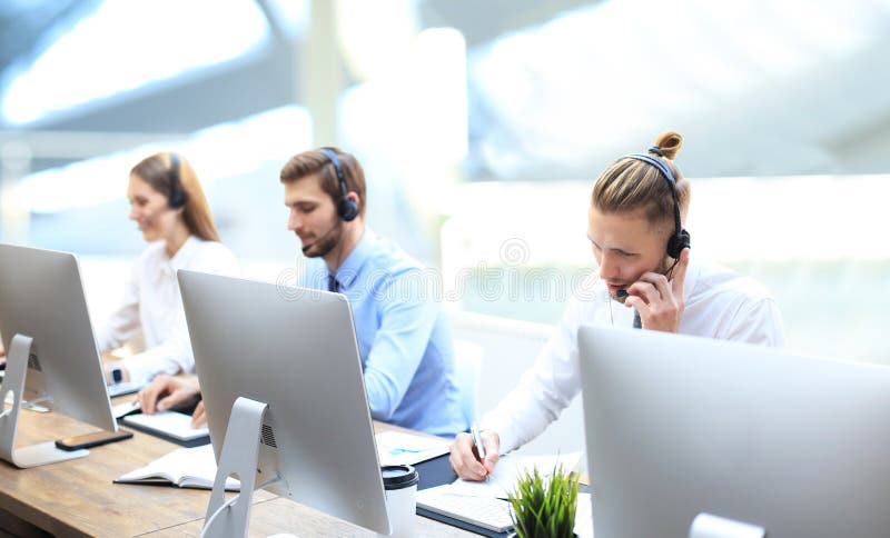 Portrait of Call Center Worker Accompanied by His Team. Smiling ...