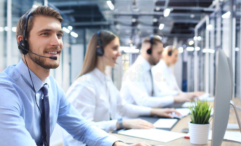 Portrait of Call Center Worker Accompanied by His Team. Smiling ...