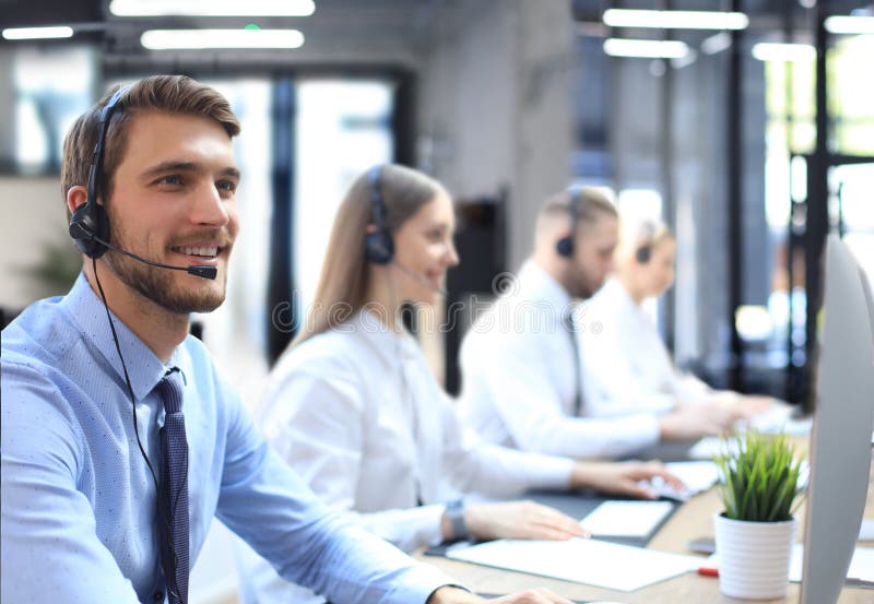 Portrait of Call Center Worker Accompanied by His Team. Smiling ...
