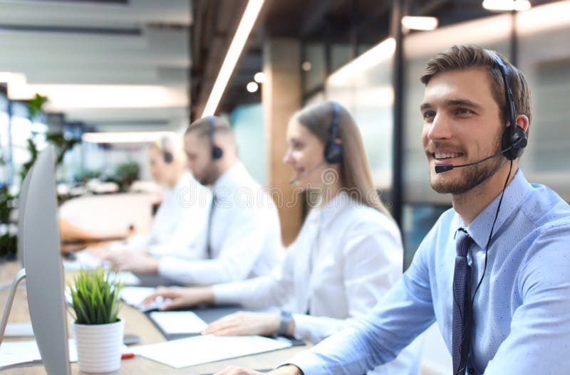 Portrait of Call Center Worker Accompanied by His Team. Smiling ...